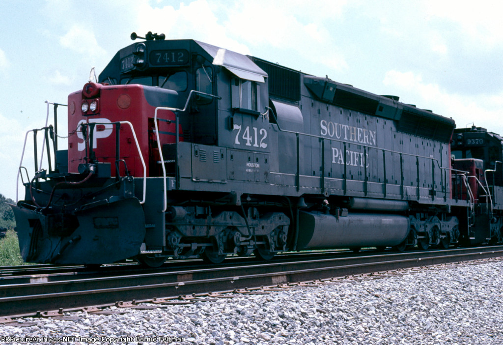 Southern Pacific SD45R #7412, flying white "class" extra flags and running as Southern Railway ...